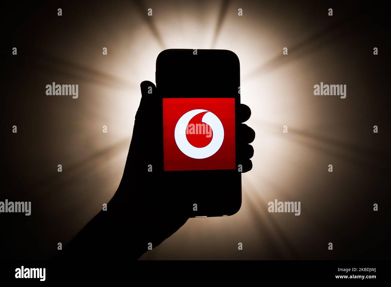 Vodafone logo is seen displayed on a phone screen in this illustration ...