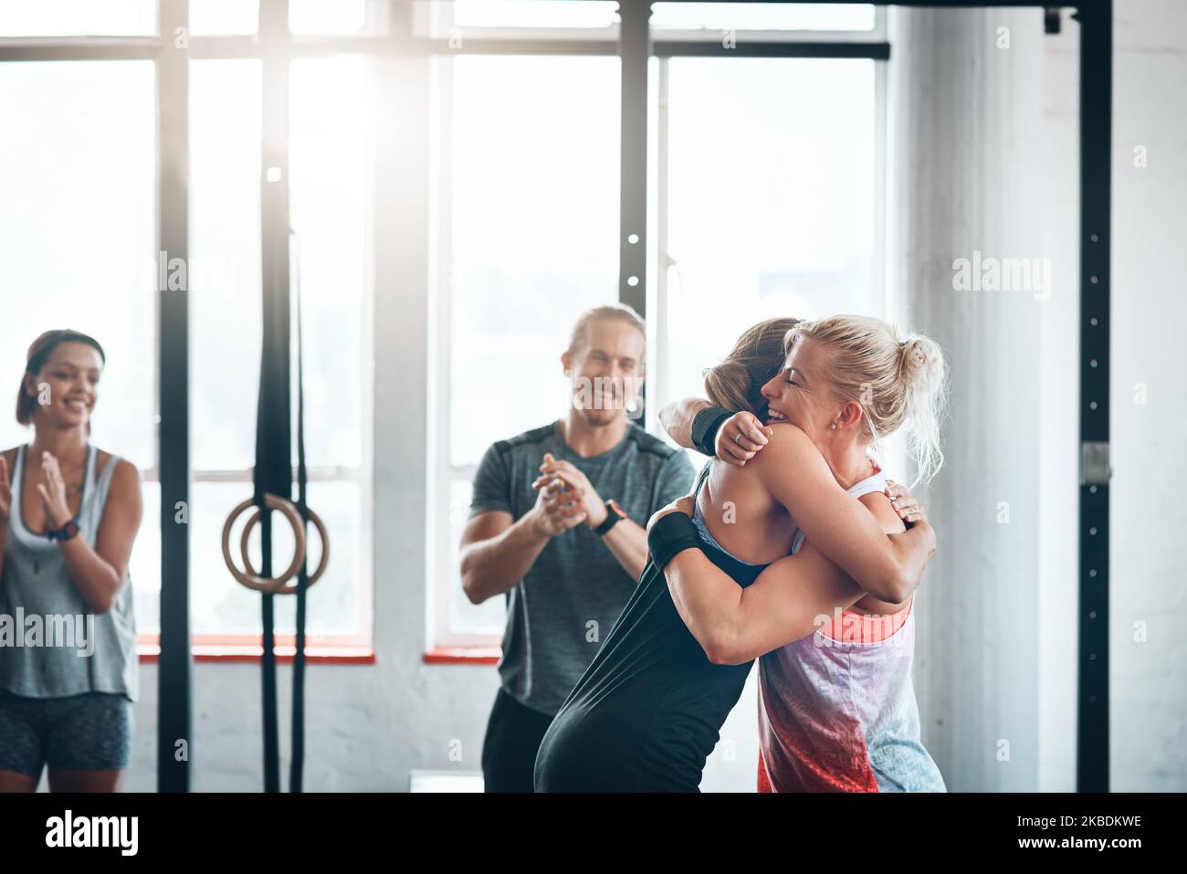 Youll thank me later. a fitness group celebrating a victory at the gym ...