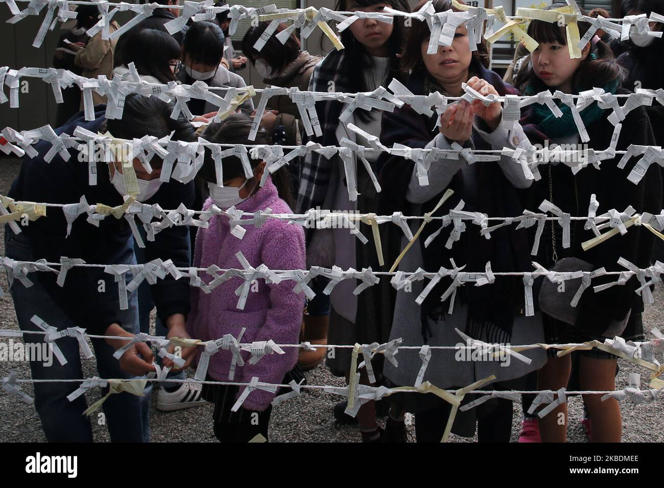 Visitors tie omikuji fortune hi-res stock photography and images - Alamy