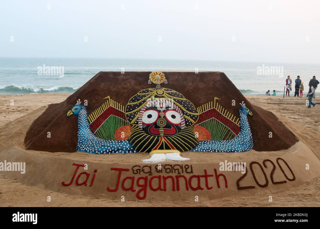 A new year 2020 sand sculpture is seen at the Bay of Bengal Sea's ...