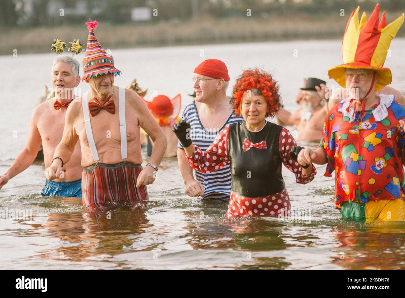 Participants of the Berlin Seals Association dressed as clowns stand in ...