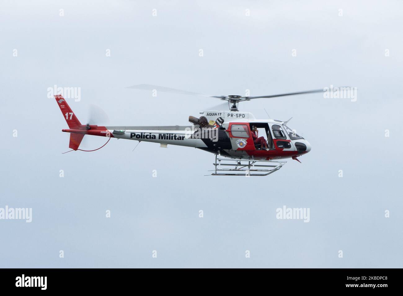 Military police helicopter flying over Boqueirão beach in Santos ...