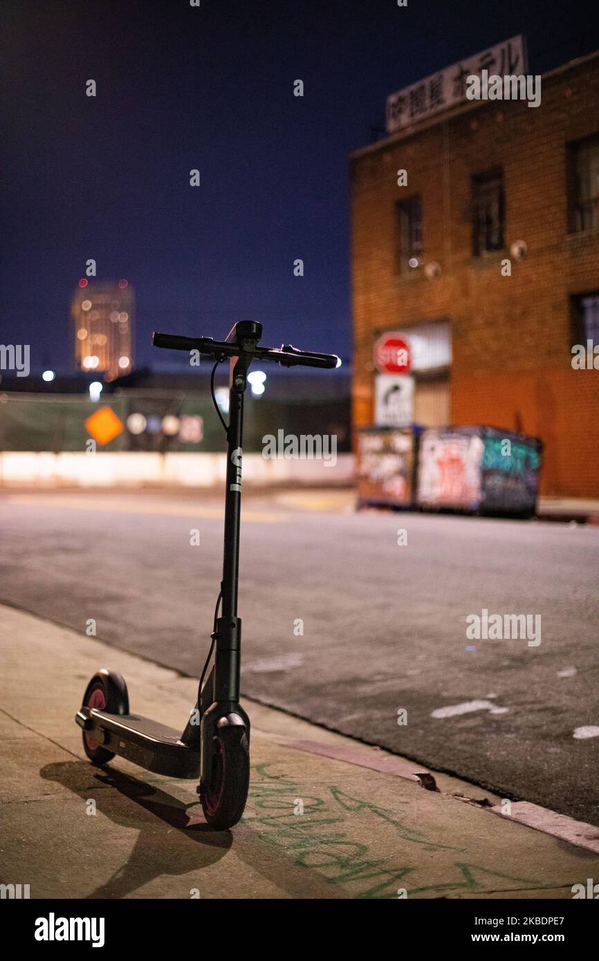 A scooter rental awaits commuters at night in Downtown Los Angeles, CA ...