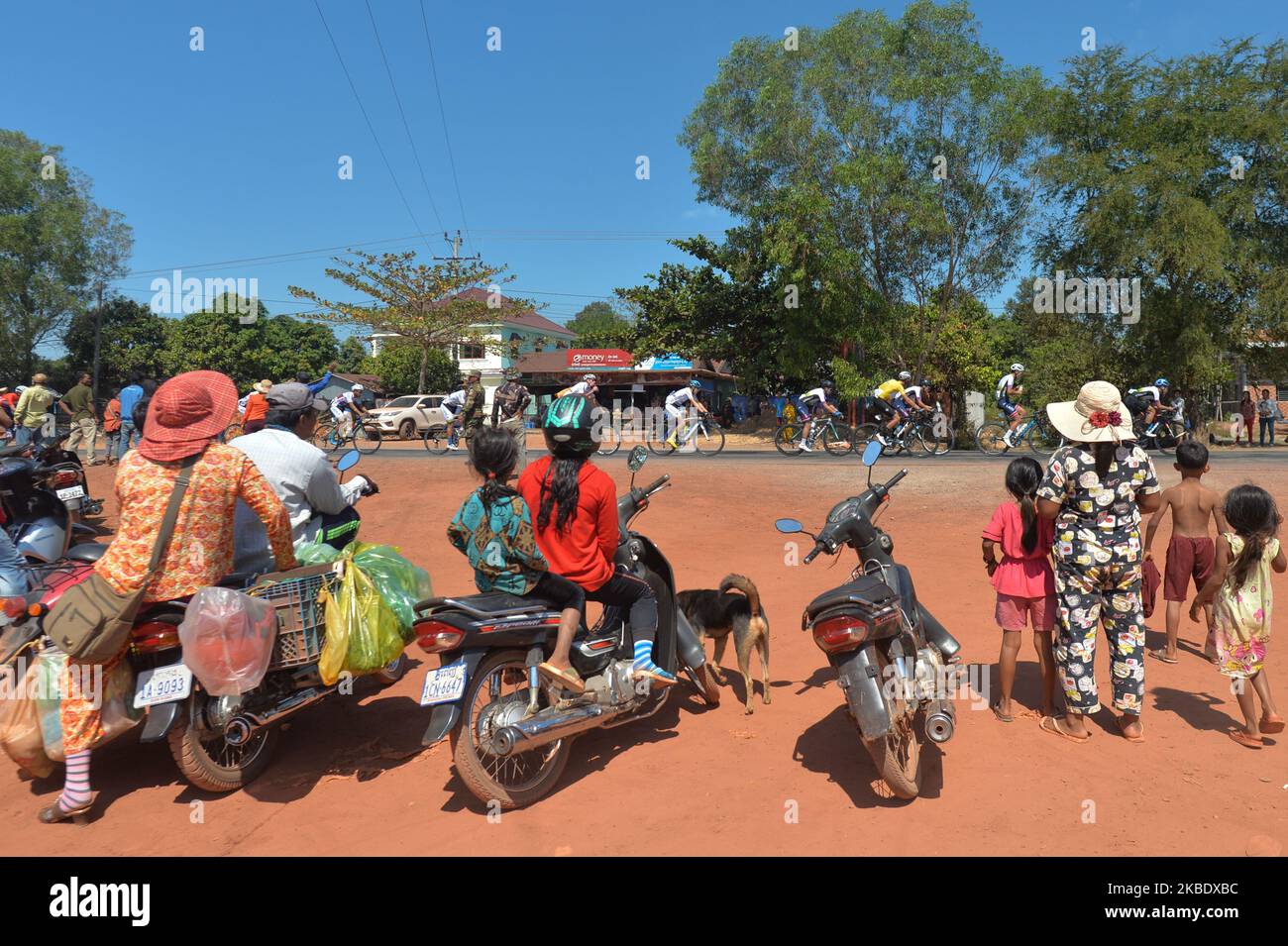 Locals watch riders in action during the second stage of the inaugural ...
