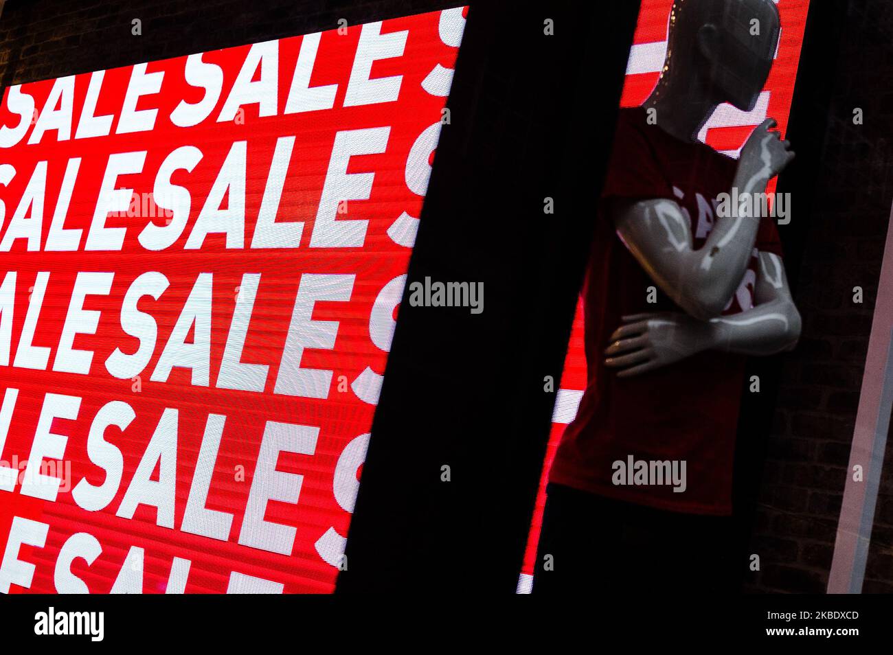 Sales signs cover a digital display in the entrance of a branch of ...