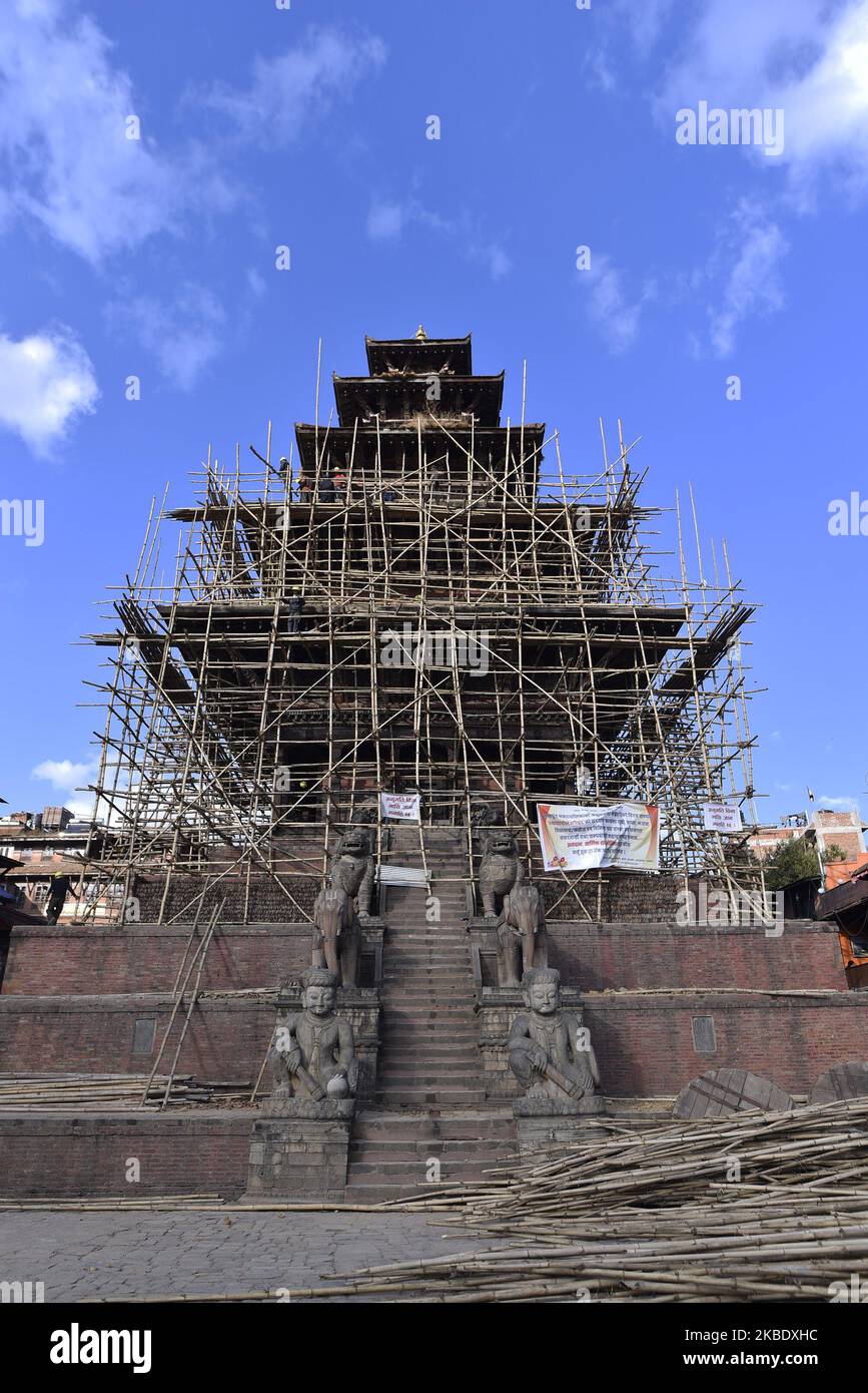 Nepalese workers renovating Nyatapola, the five-storey temple, which is ...