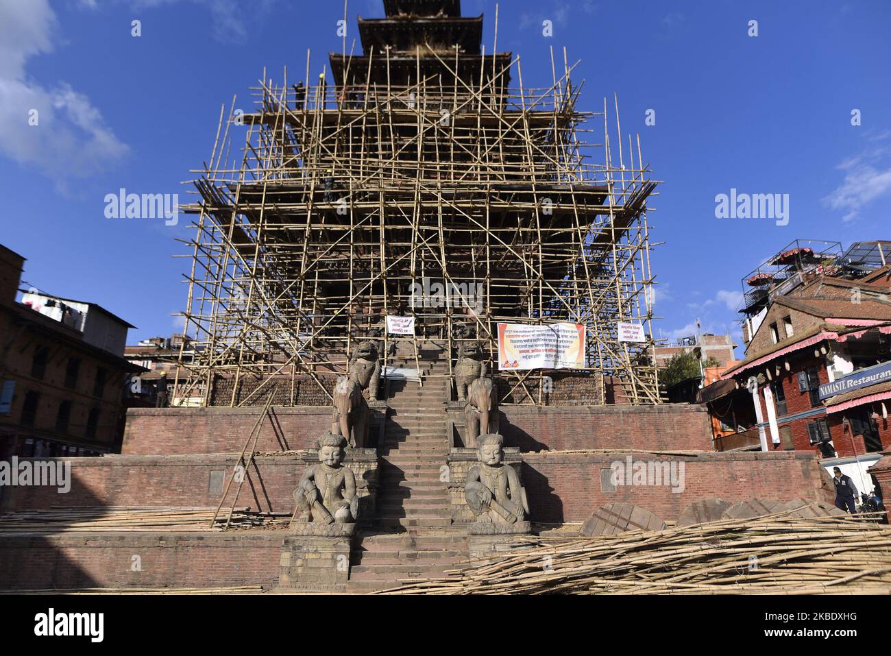 Nepalese workers renovating Nyatapola, the five-storey temple, which is ...