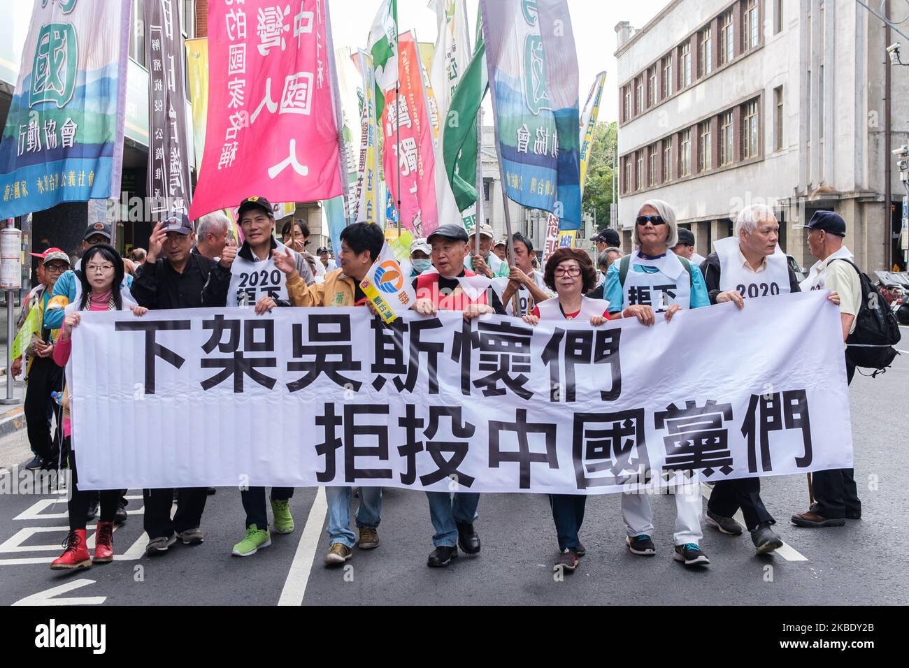 Protesters marching in Taipei, on January 5, 2020 holding flags from ...