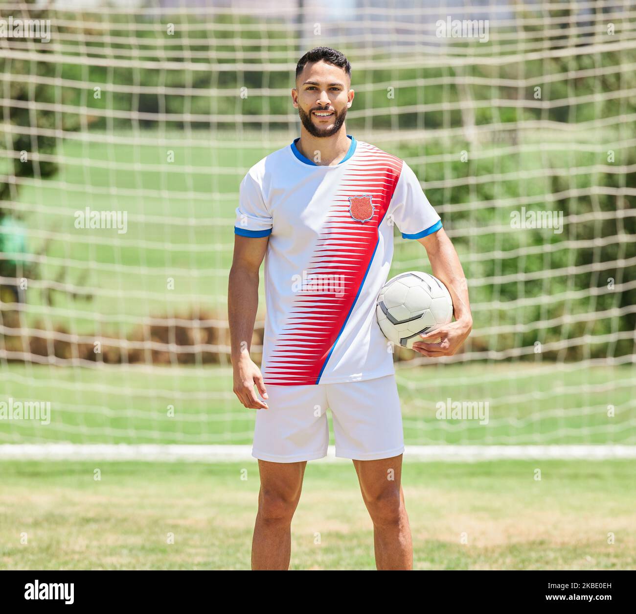 Fitness, sports and soccer player portrait on a football field ready to ...