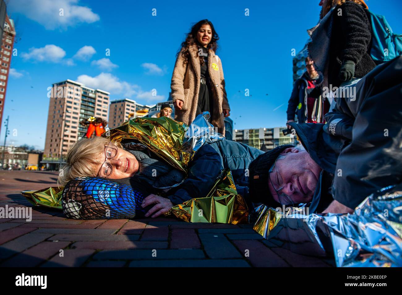 An activist is laying on the floor during a Die-in action carried by XR ...