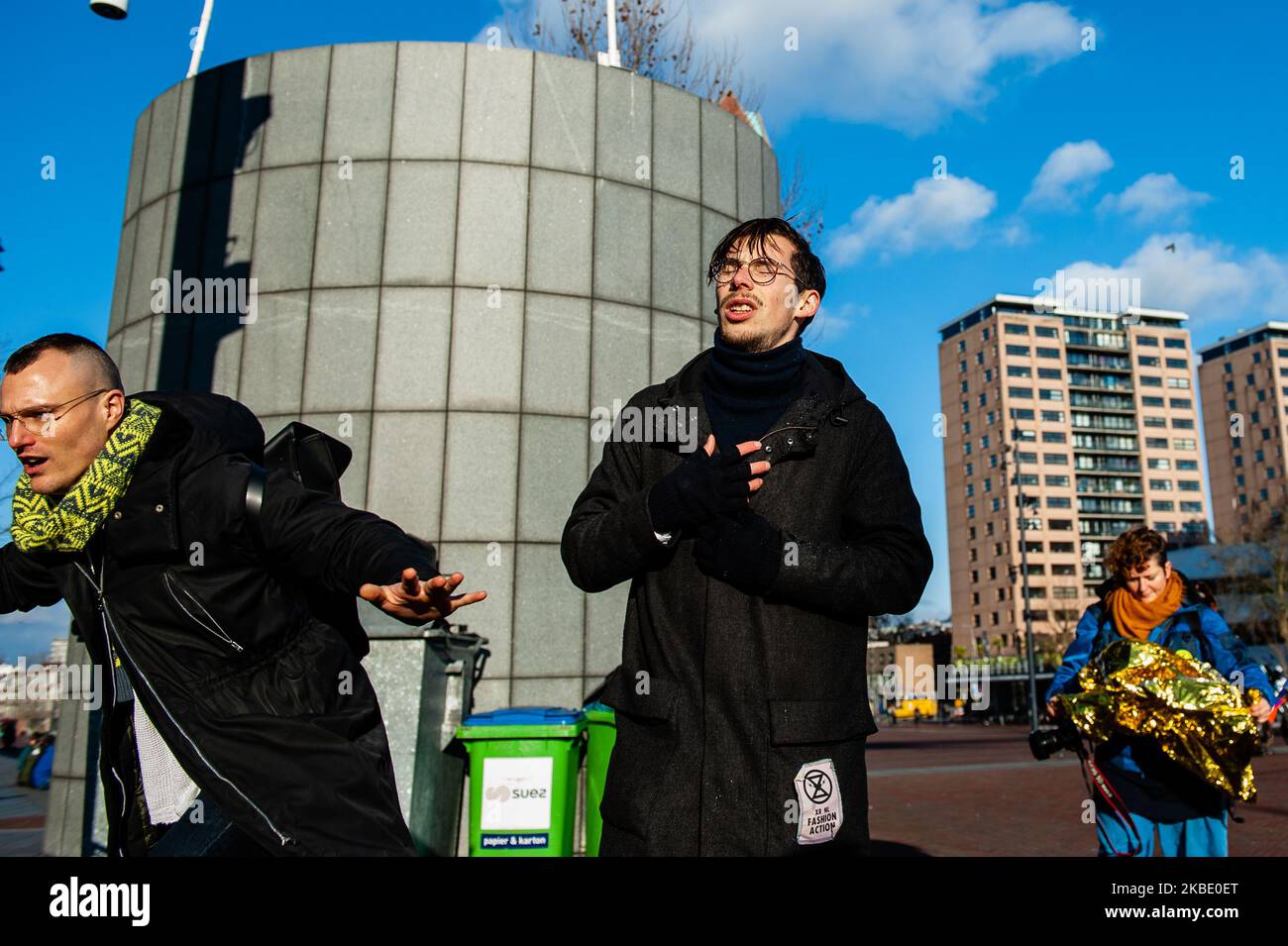 An XR activist is performing a dramatic situation during a Die-in ...