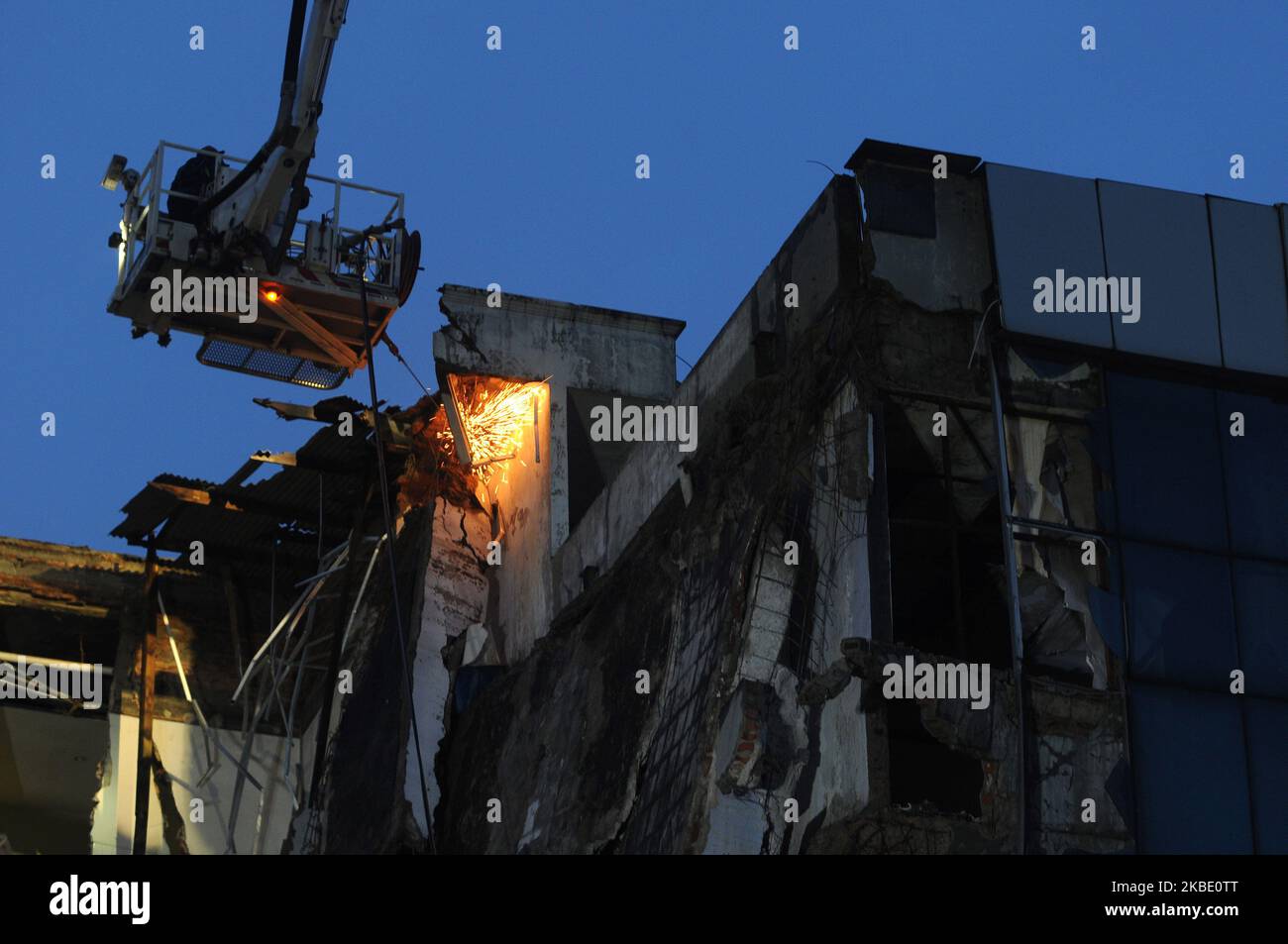 The evacuation team cut down the 5-story collapsed concrete part of the ...