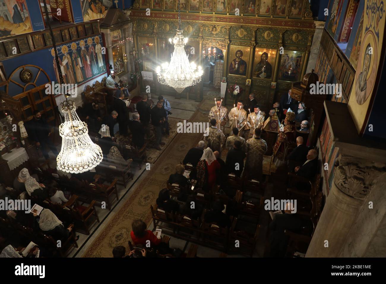 Palestinian Orthodox Christians attend Christmas mass at a church in ...