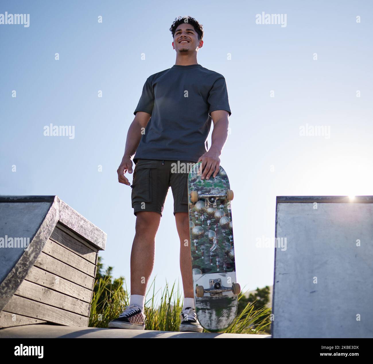 Skateboard, sports and man on ramp at community skate park for freedom ...