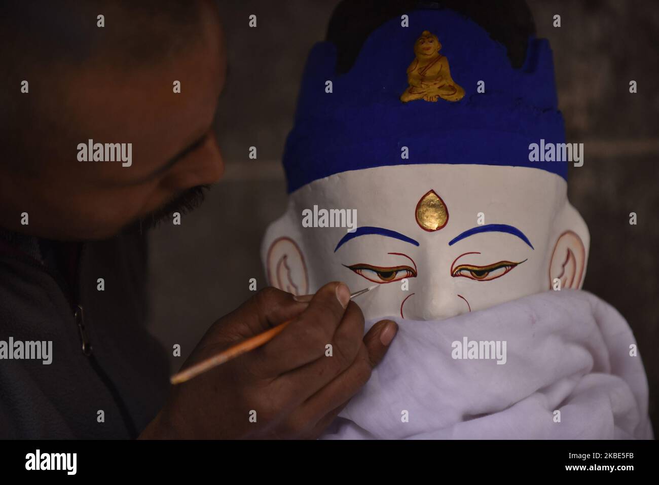 A priest decorate the idol Seto Machhendranath at Jana Bahal, Kathmandu ...