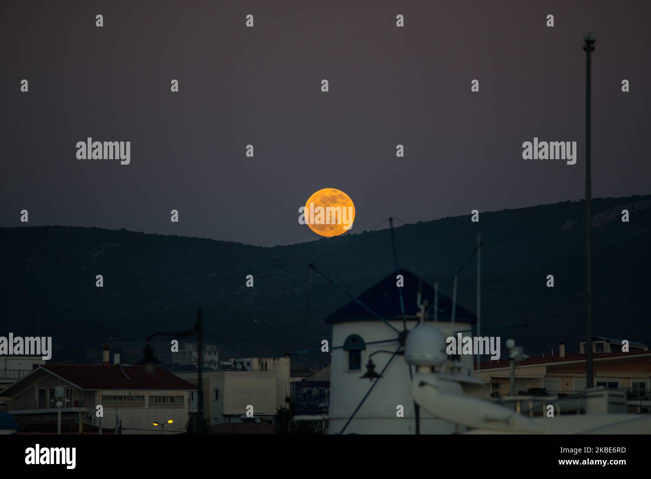 First full moon of 2020, wolf moon, shows up upon the harbor of Nea ...