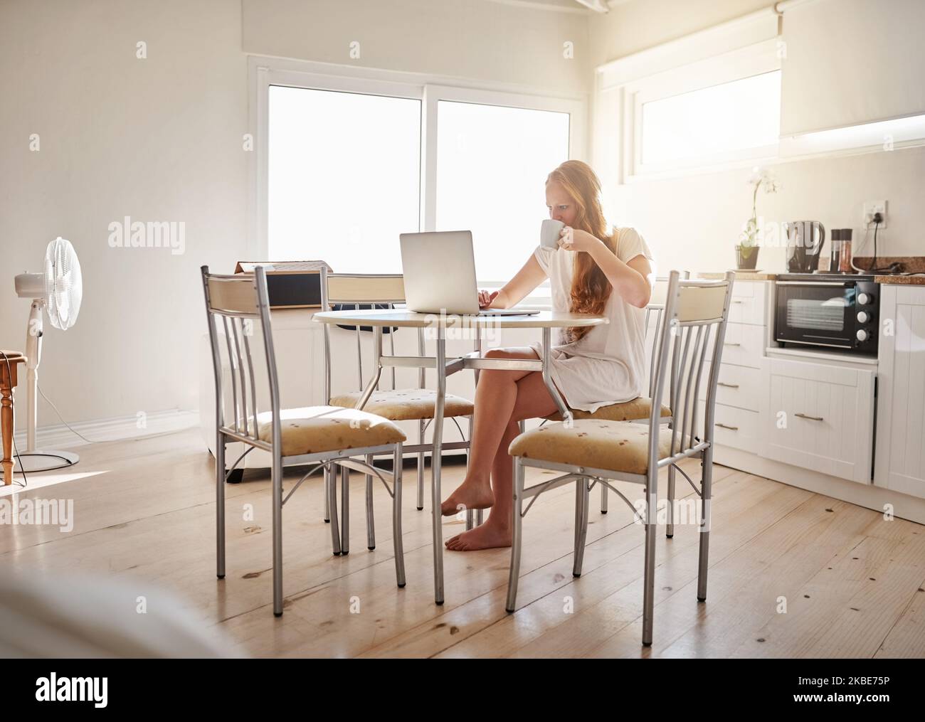 I love just chilling on the weekend with my laptop. a young woman at ...