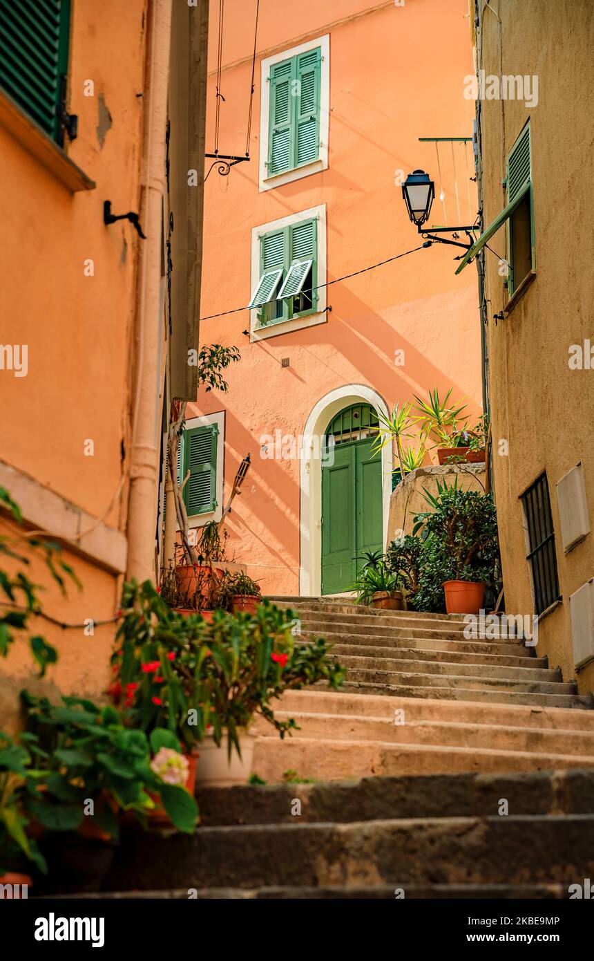 Traditional old terracotta houses on a narrow street in the Old Town of ...