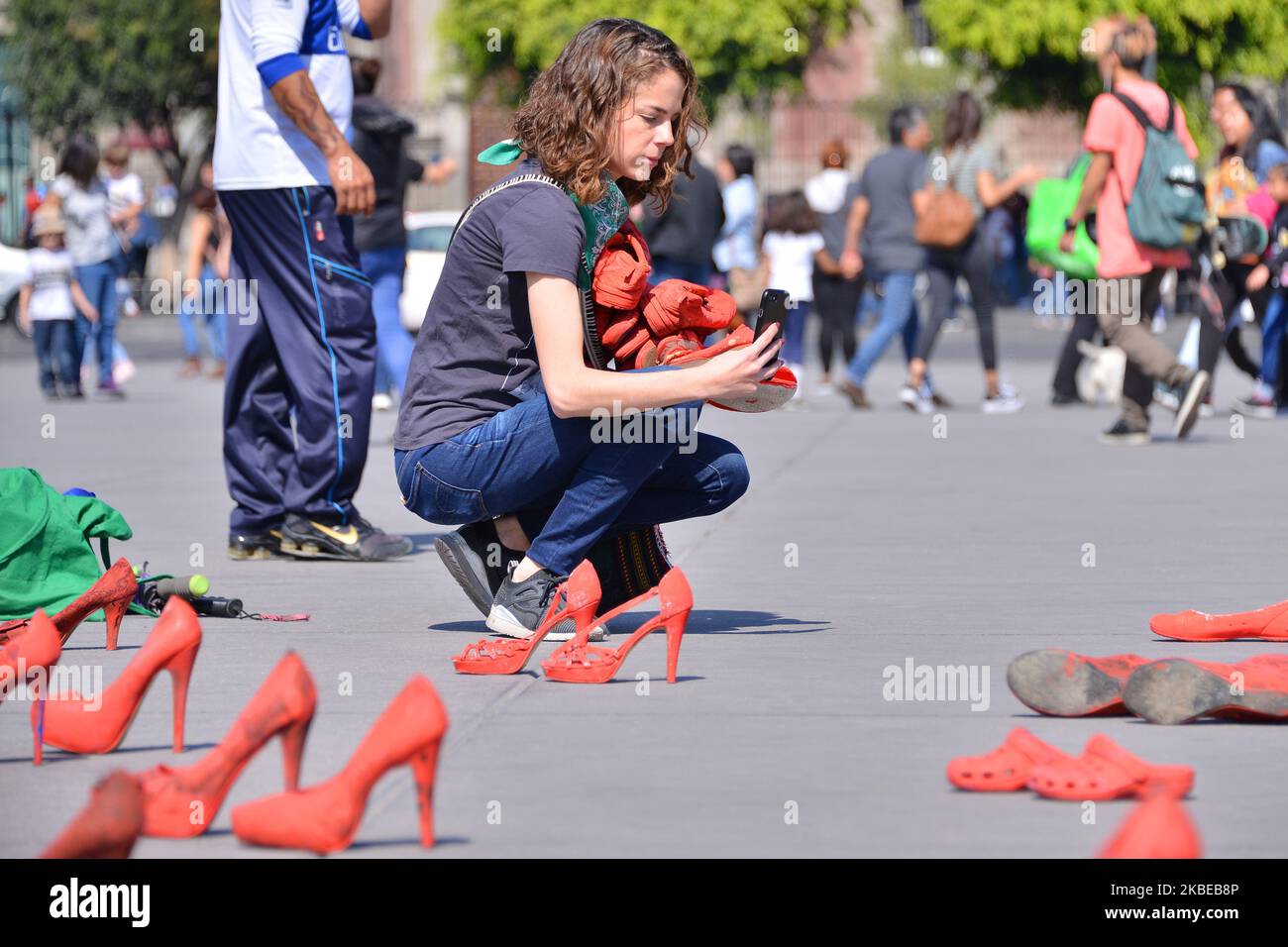 A group of women join at Zocalo to take part during a protest with red ...