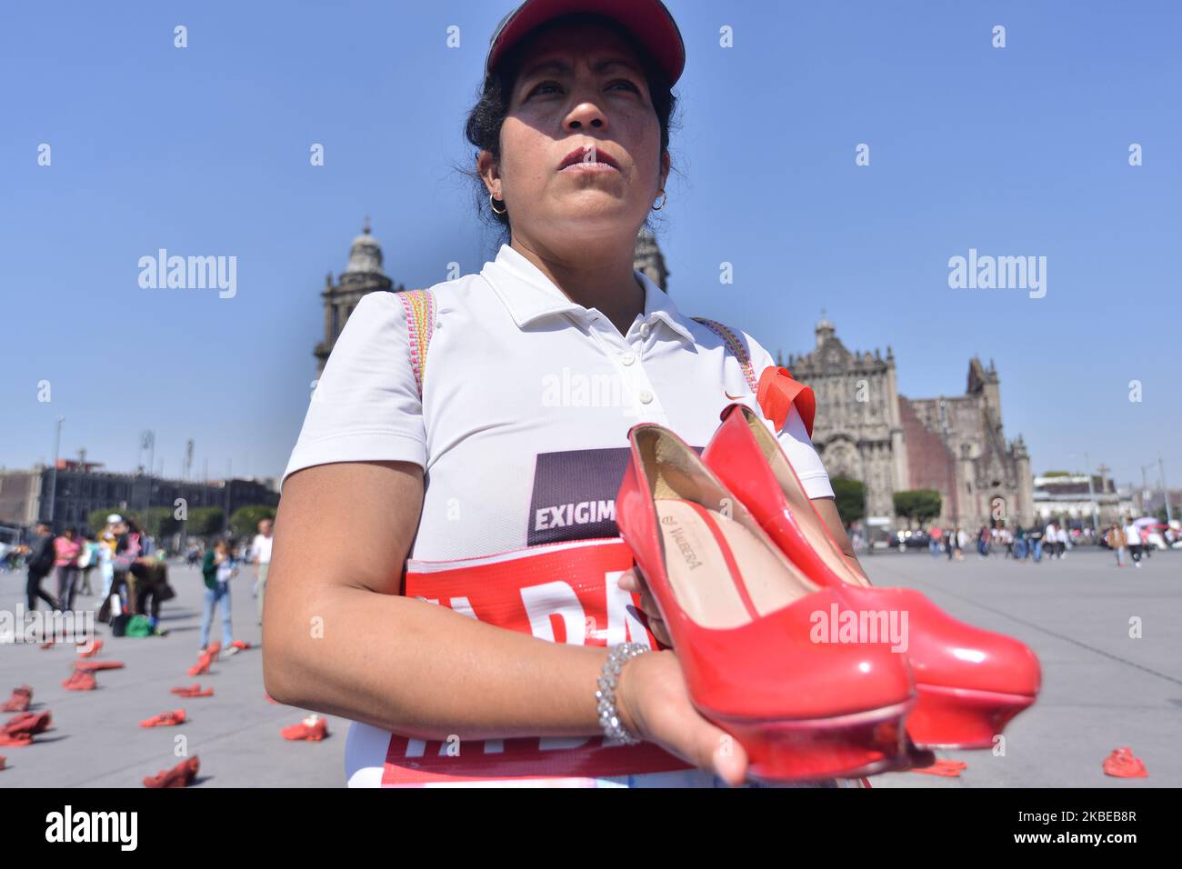 A group of women join at Zocalo to take part during a protest with red ...