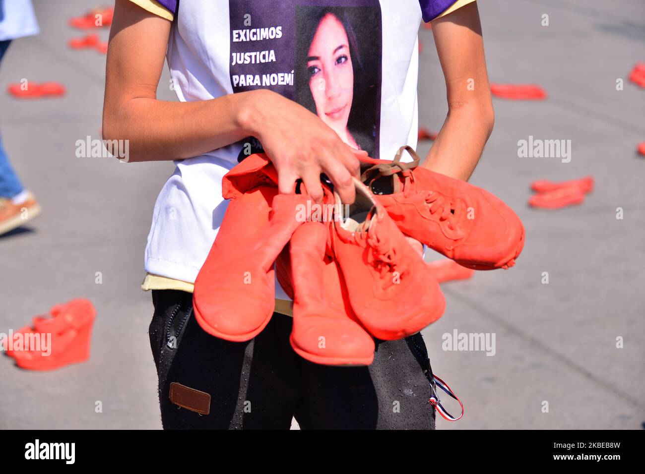 A group of women join at Zocalo to take part during a protest with red ...