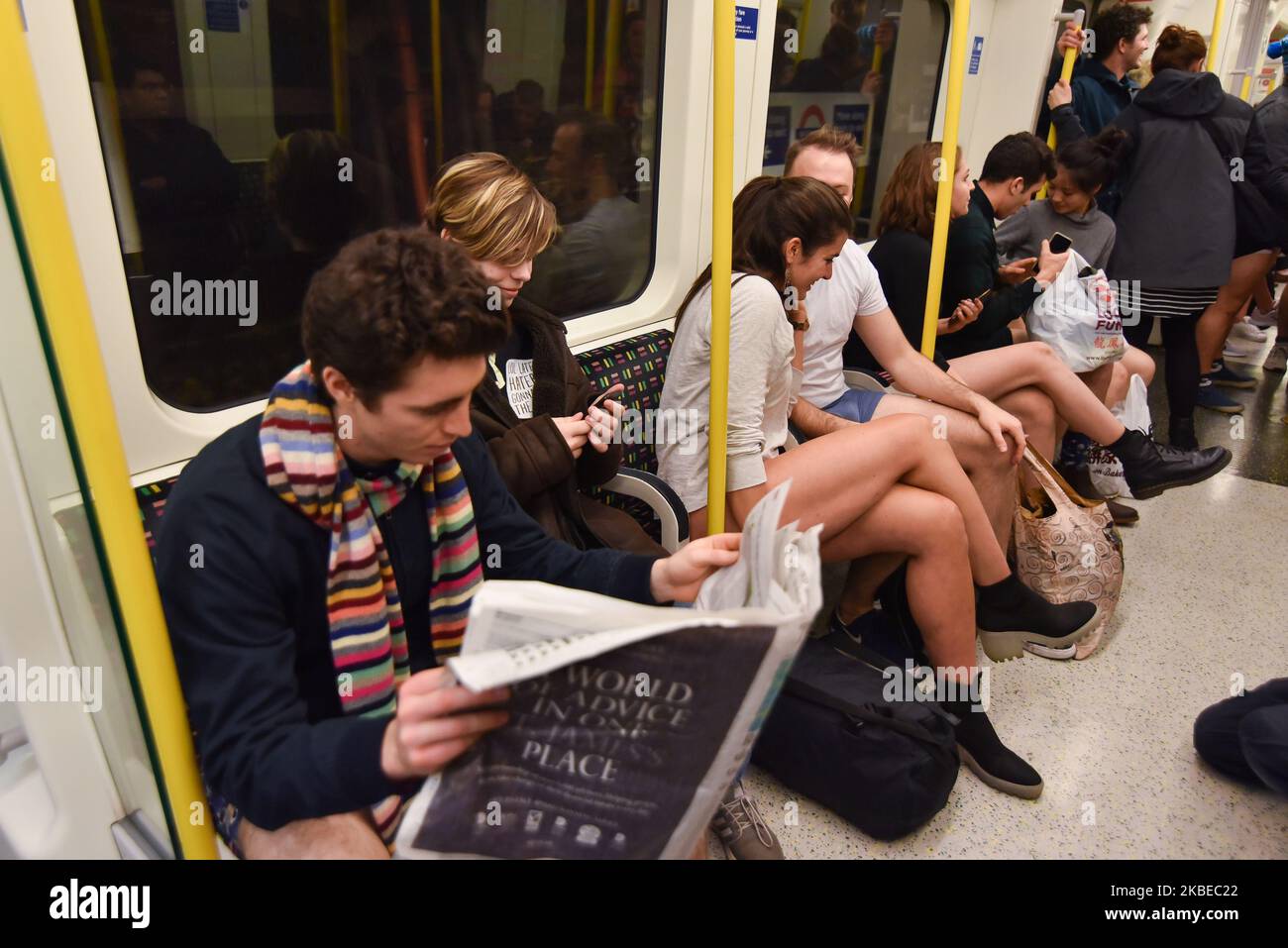 People ride the London Underground without trousers as they attend the ...