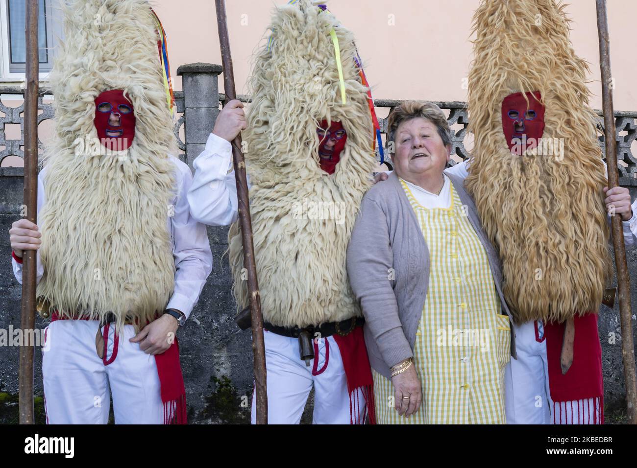 A neighbor poses proudly with some of “Los Sidros” participating in the ...