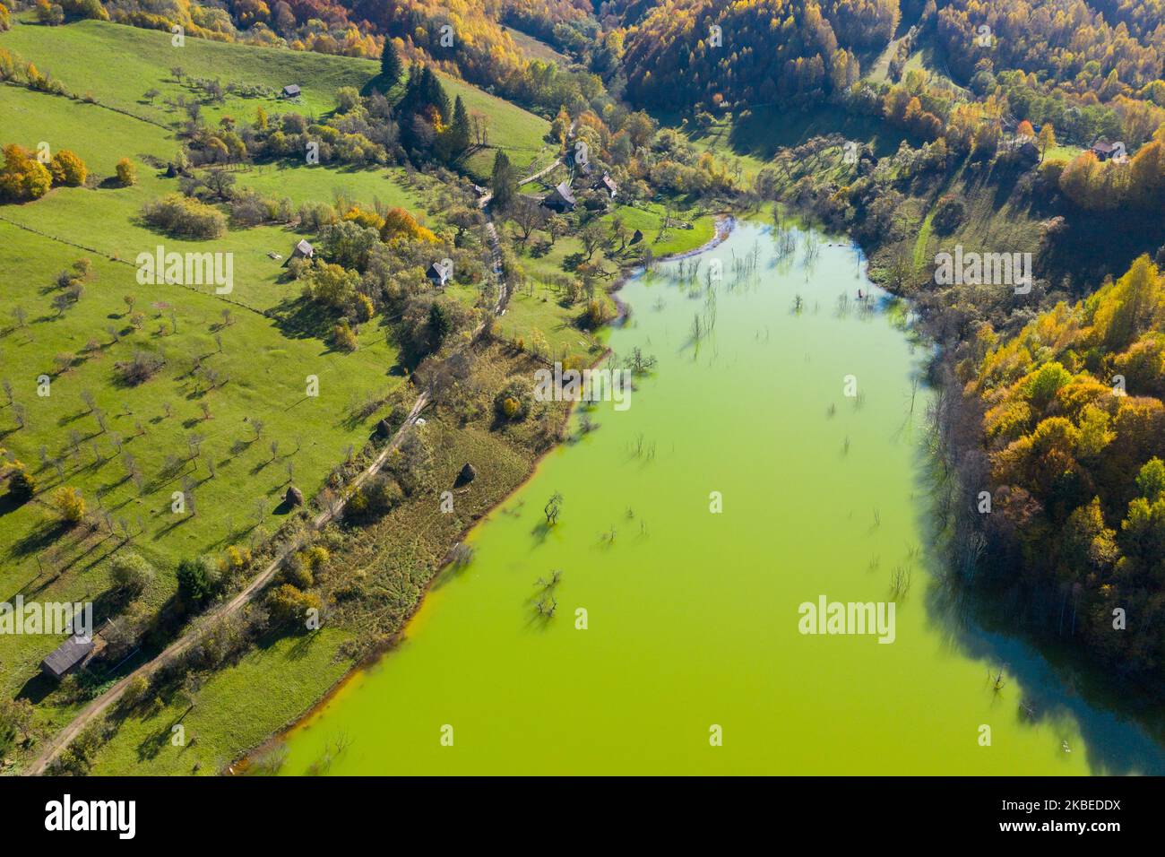 Aerial view of green mine waters from a copper mine flooding natural ...