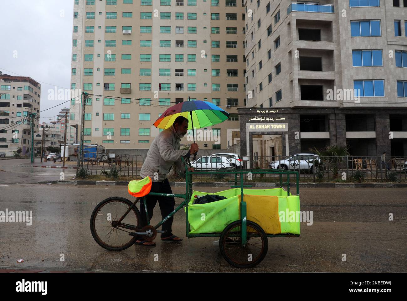 A Palestinian man selling candy walks in Gaza city on January 13, 2020 ...