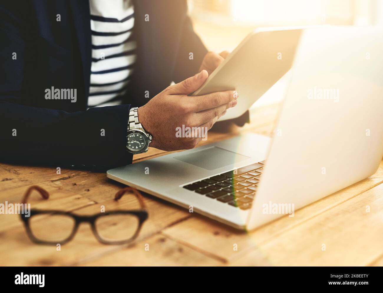Connect and keep productive. a businessman using a digital tablet and ...