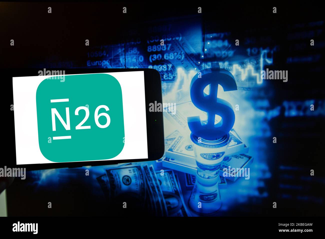 The logo of N26 is seen on a screen of a smartphone next to an ...