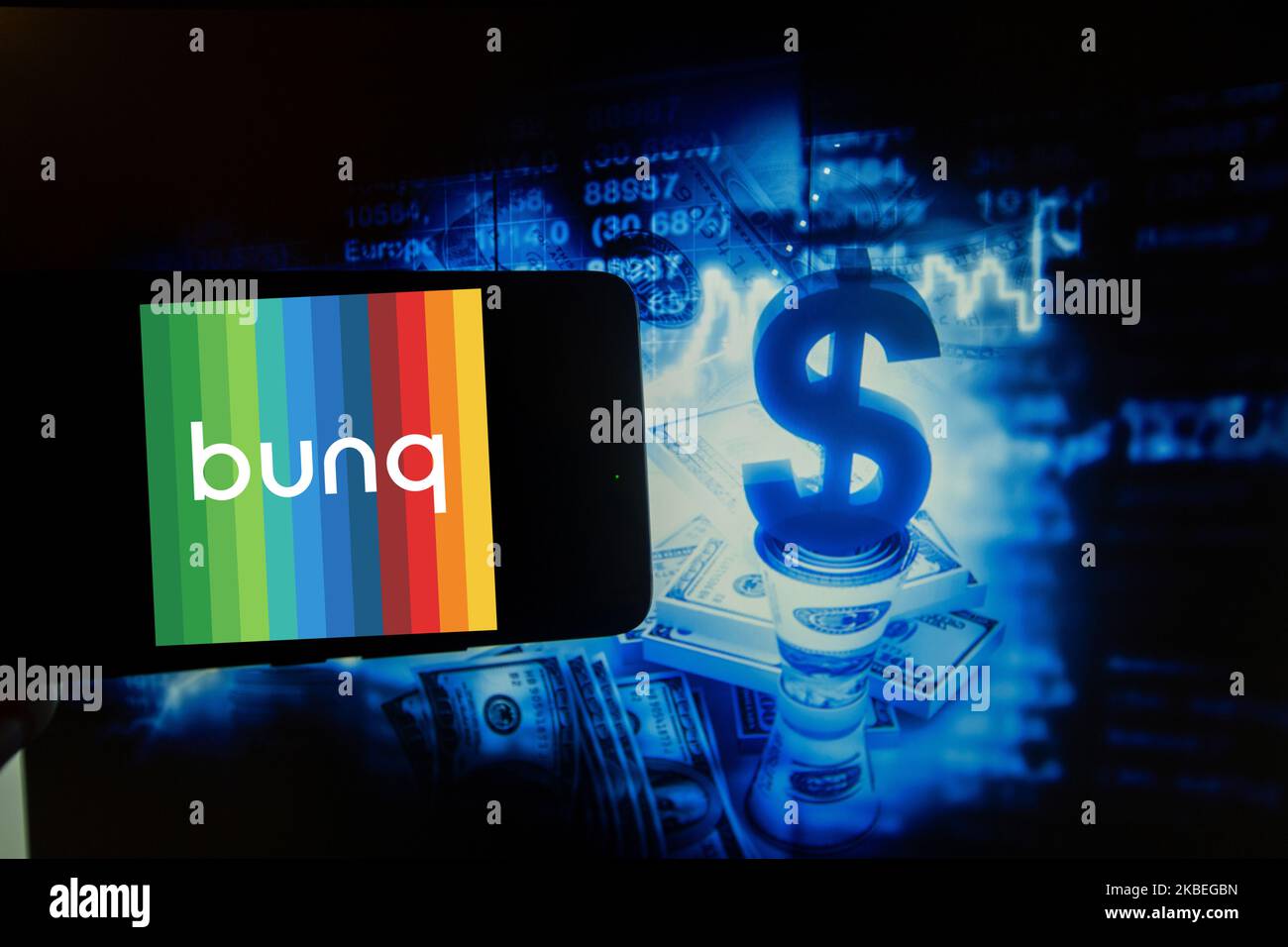The logo of Bunq is seen on a screen of a smartphone next to an ...