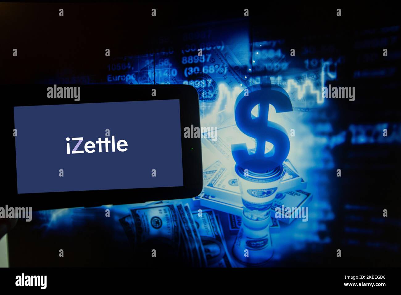 The logo of iZettle is seen on a screen of a smartphone next to an ...