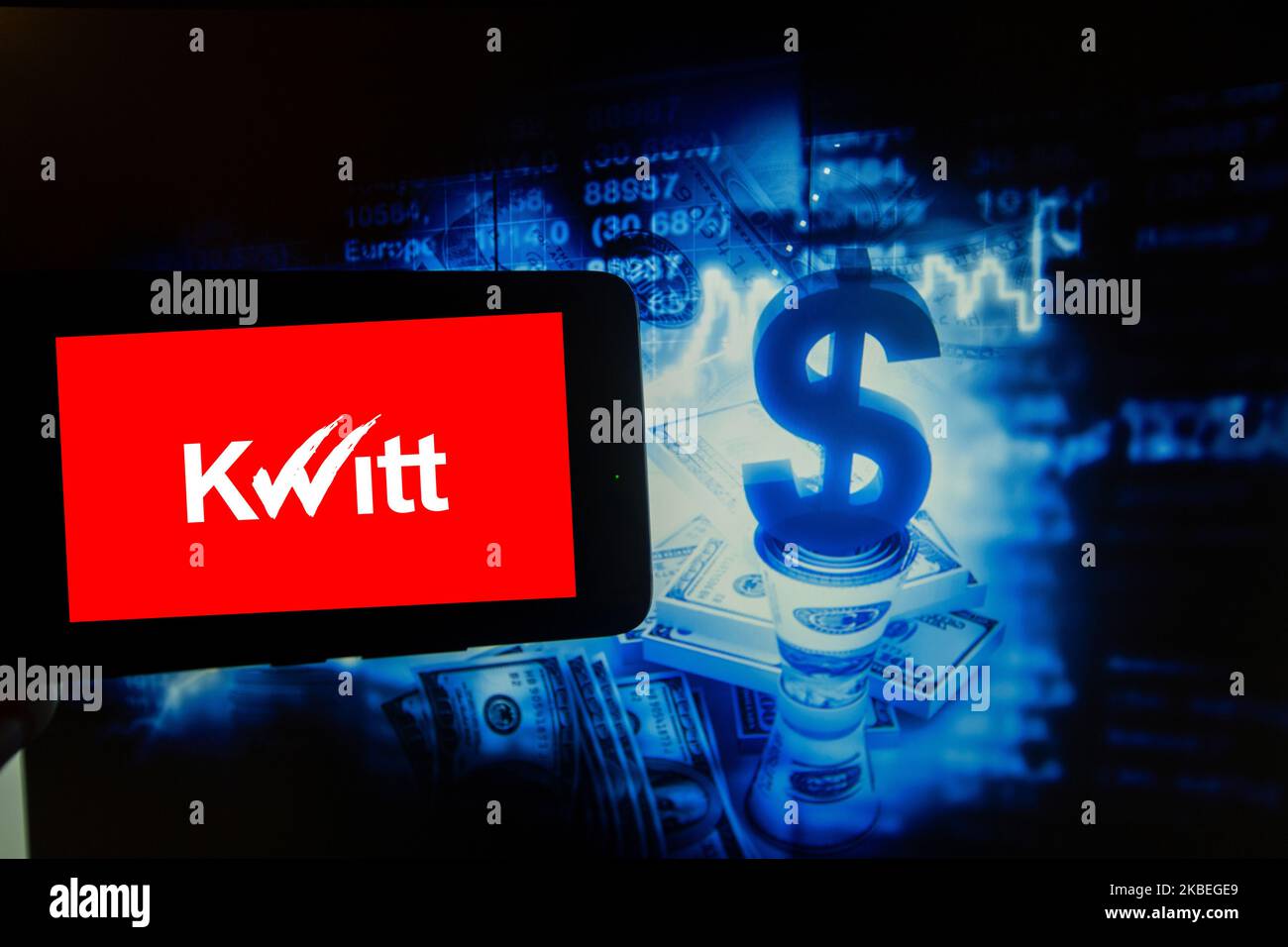 The logo of Kwitt is seen on a screen of a smartphone next to an ...