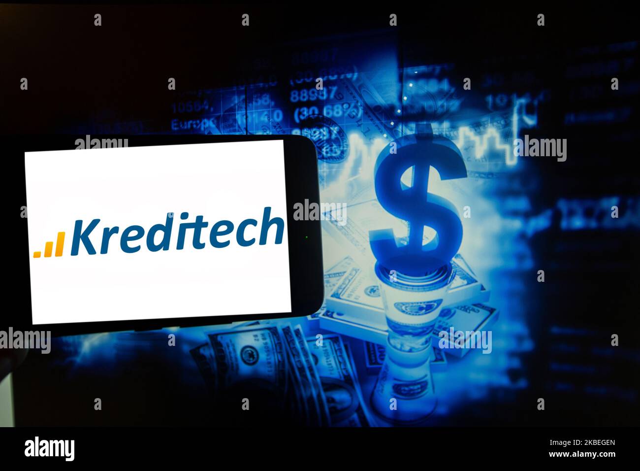 The logo of Kreditech is seen on a screen of a smartphone next to an ...