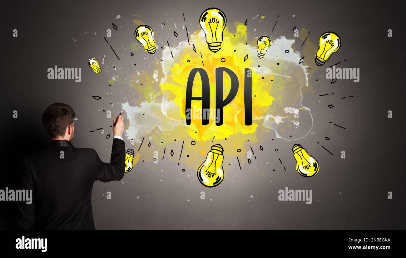 man drawing colorful light bulb Stock Photo - Alamy