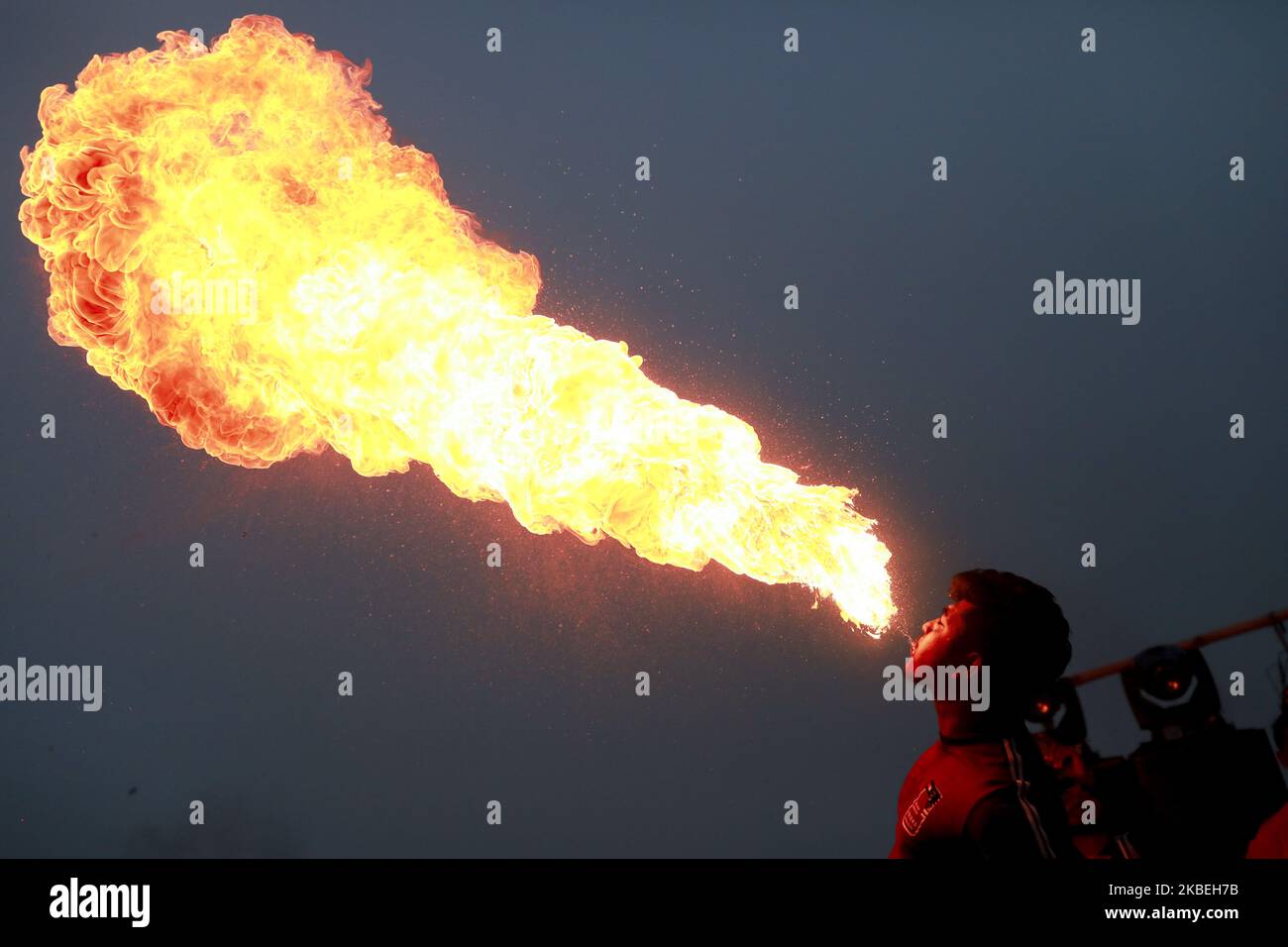 People of Old Dhaka are playing fire splitting using kerosene oil on ...