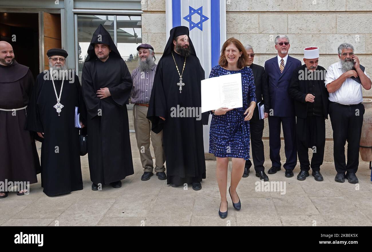 Christian, Jewish, Muslim and Druze clergy pose for a group photo with ...