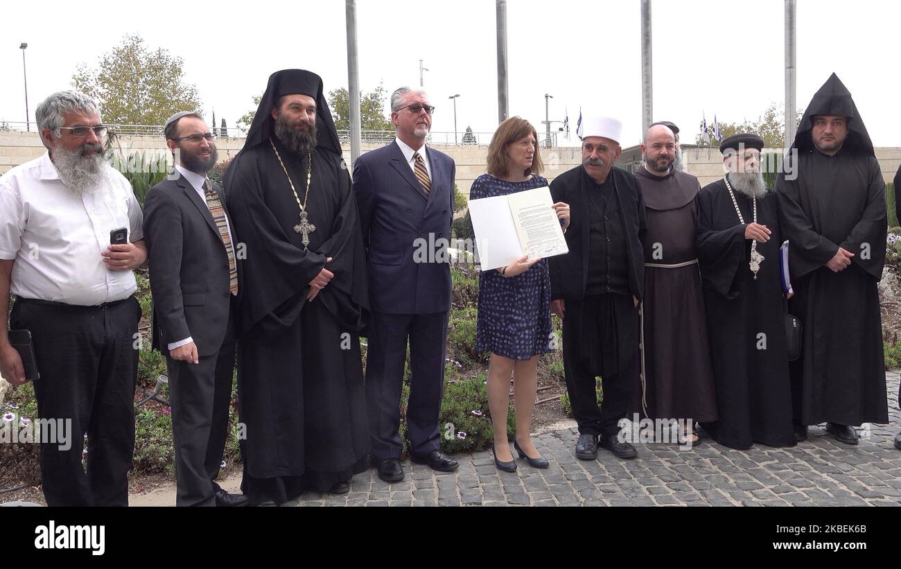 Christian, Jewish, Muslim and Druze clergy pose for a group photo with ...