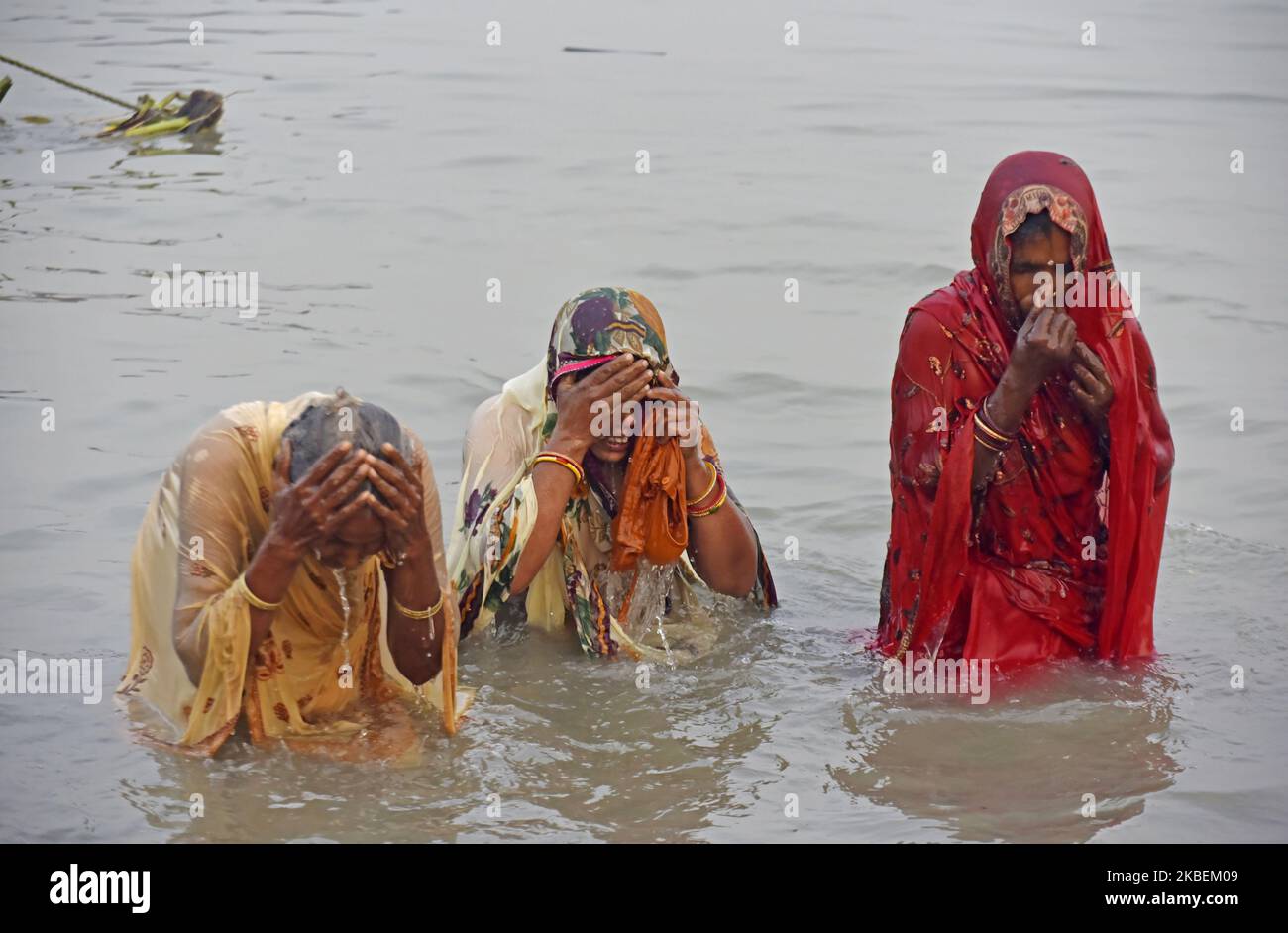 Hindu devotees take a holy dip on the river Ganga on an auspicious day ...