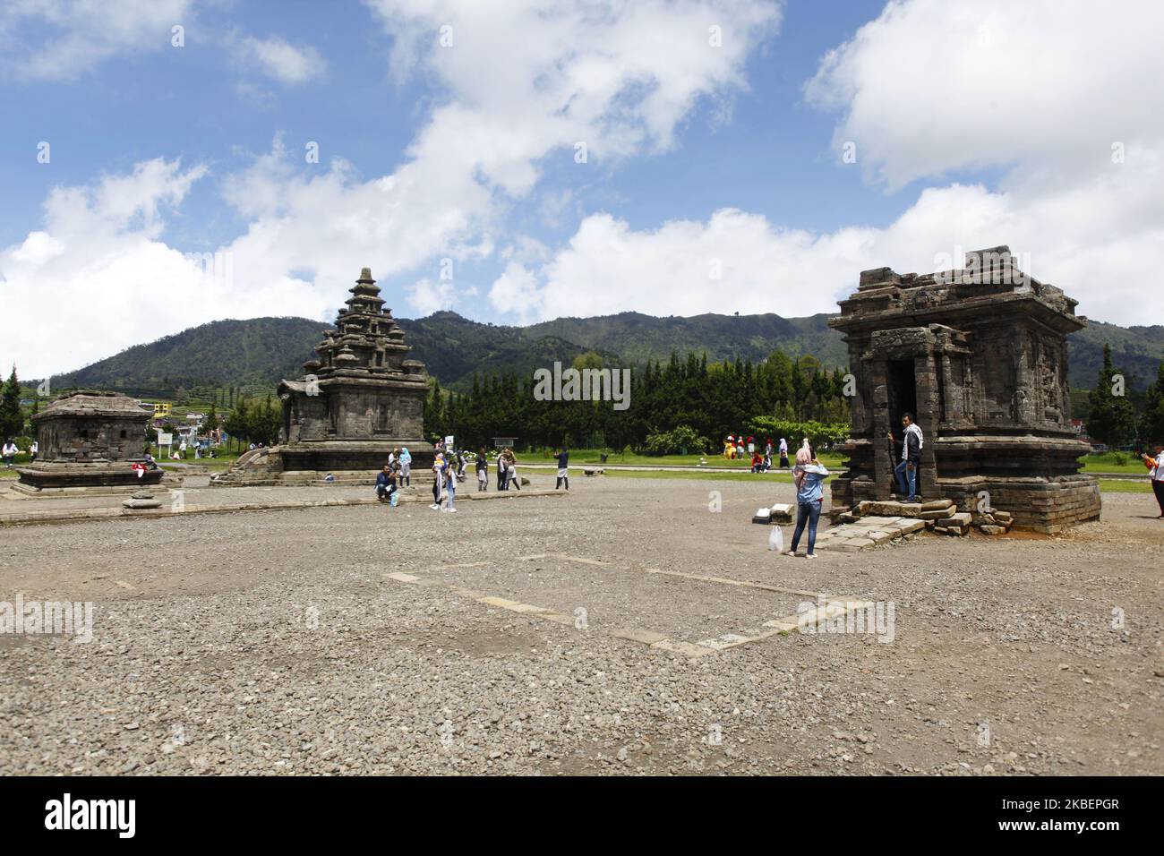 Tourists are in the Arjuna Temple complex, a Hindu temple building ...