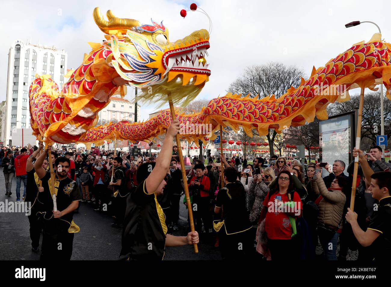 Revelers perform during celebrations for the Chinese New Year parade ...