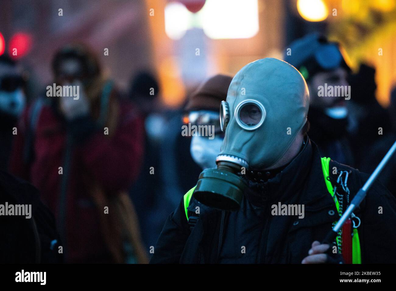 A demonstrator wearing a gas mask during the 62th round of yellow vest ...