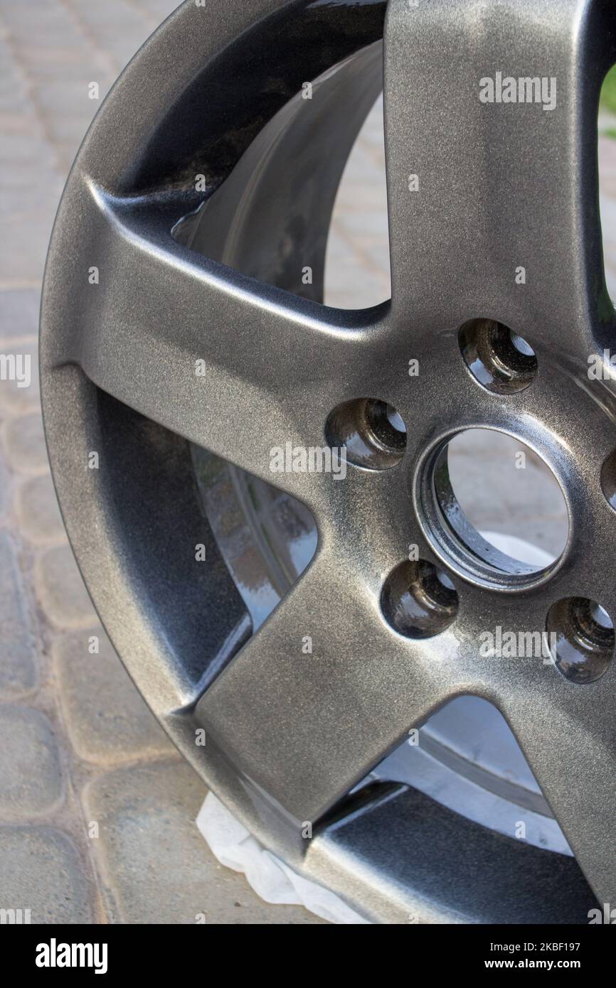 Strong wheel cast discs for a titanium car Stock Photo - Alamy