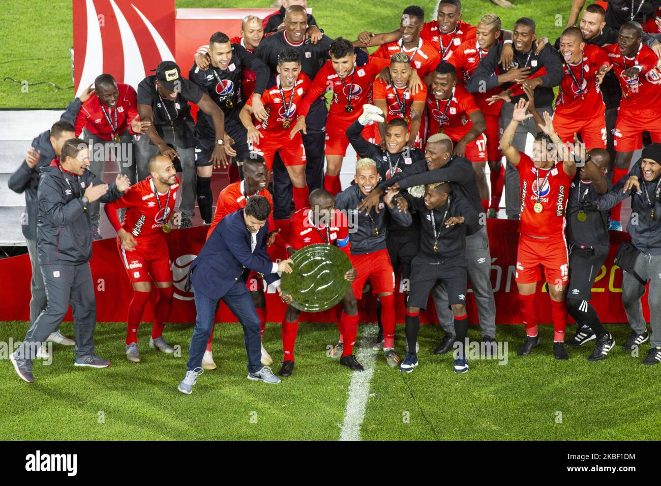 America of Cali players celebrate the victory against Millionaires and ...