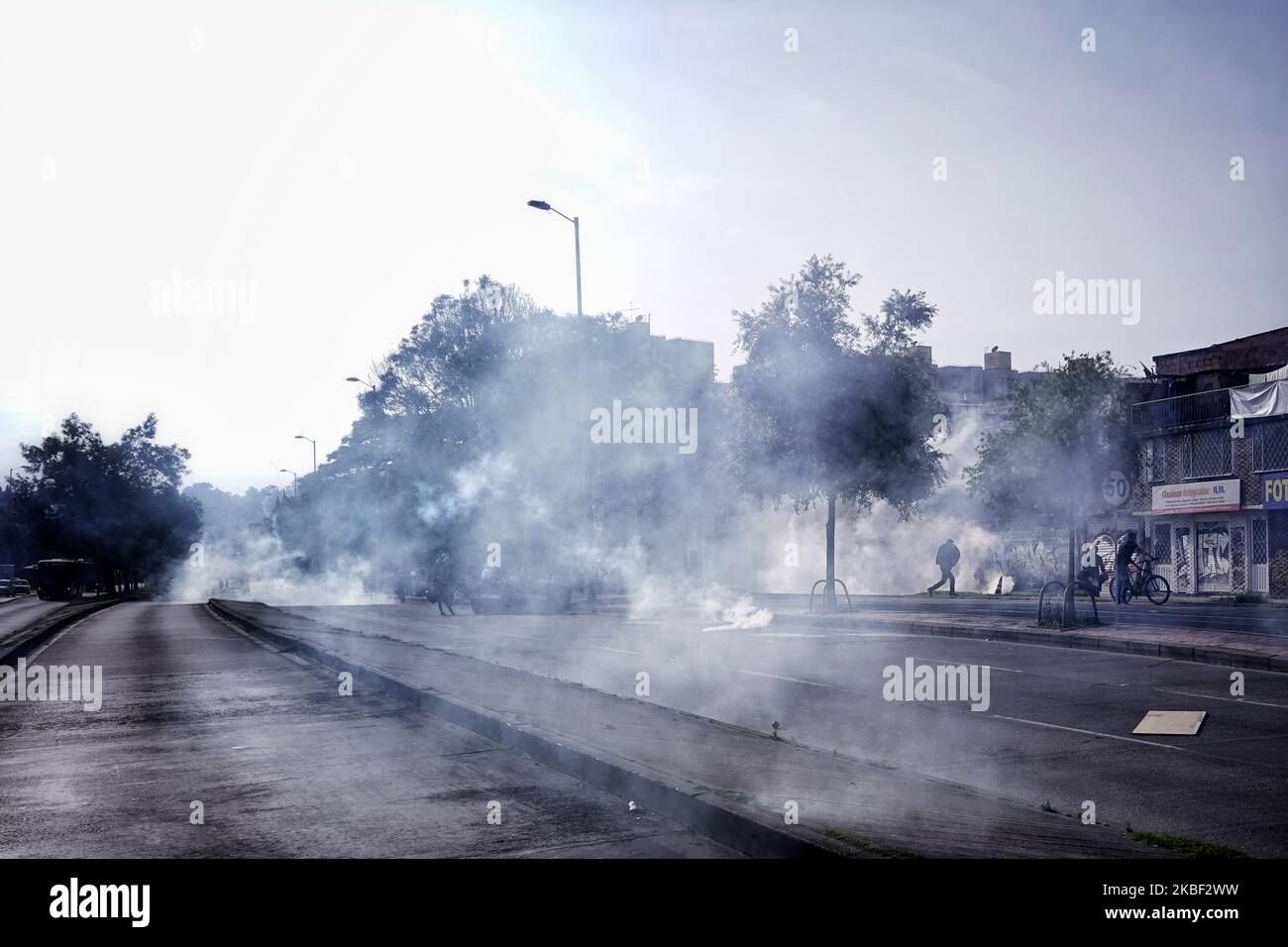 Police officers use tear gas to remove protesters during National ...
