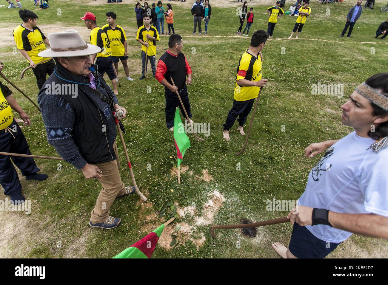 Members of Mapuche Huilliche communities play Palin. With the efkutun ...