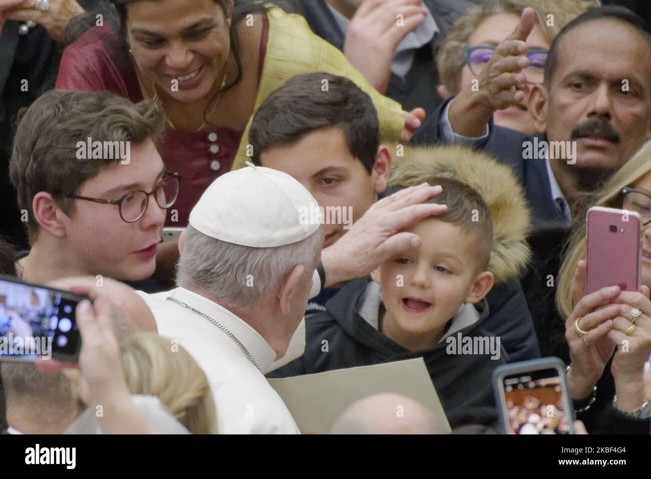 Pope Francis arrives in the Paul VI Hall at the Vatican for his weekly ...