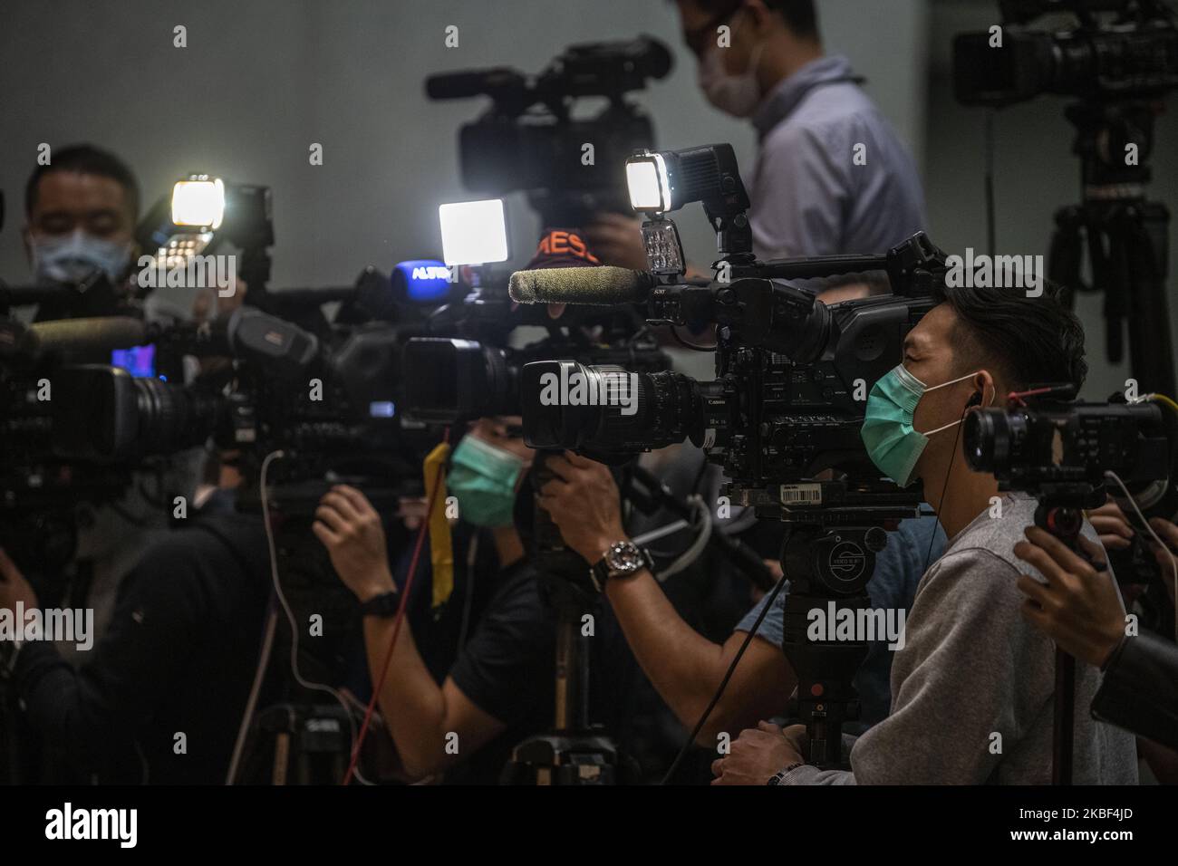 Reporters are seen wearing mask during a press conference inside the ...