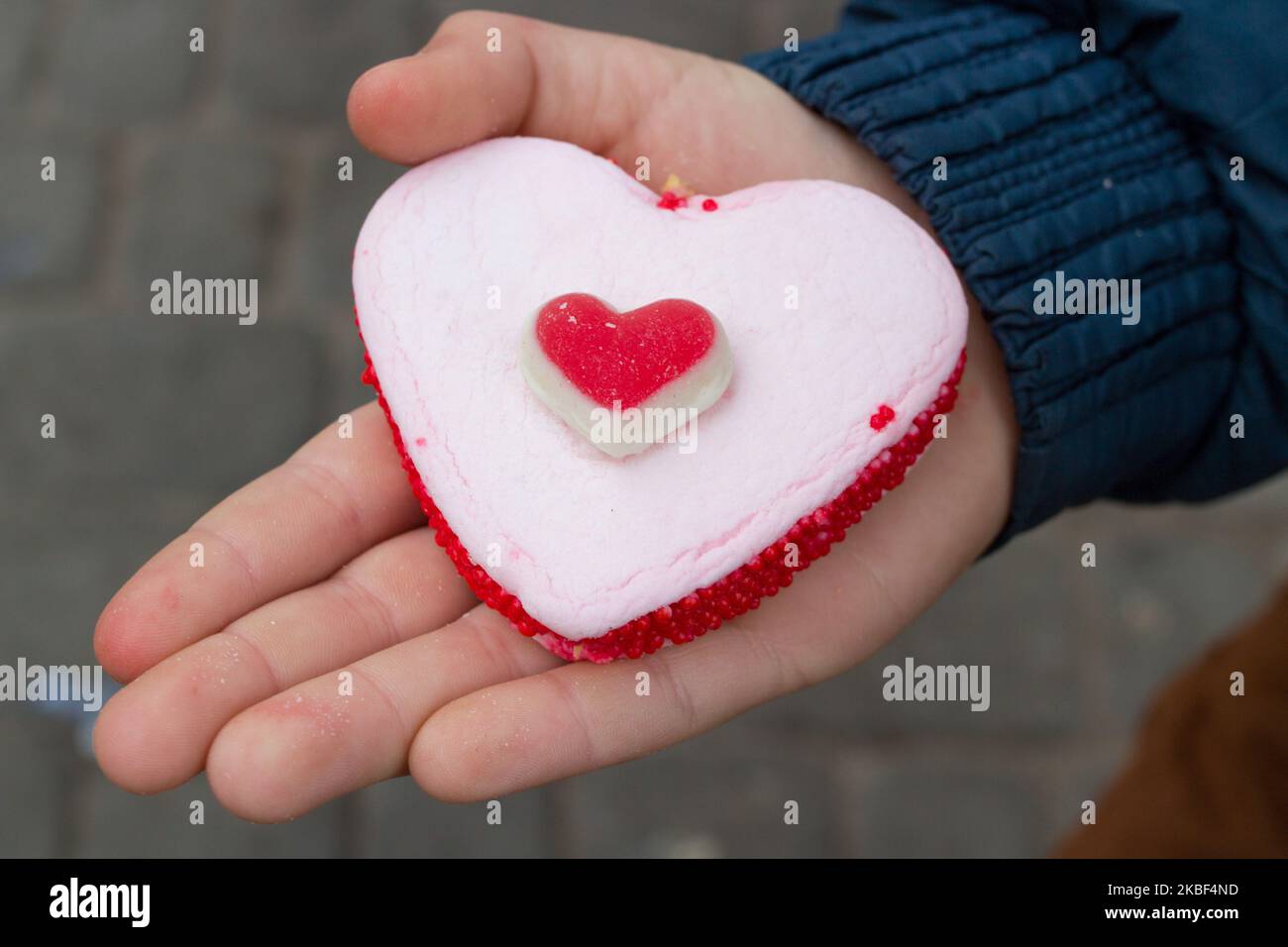 heart of mercy in the hands of a child holding Stock Photo - Alamy